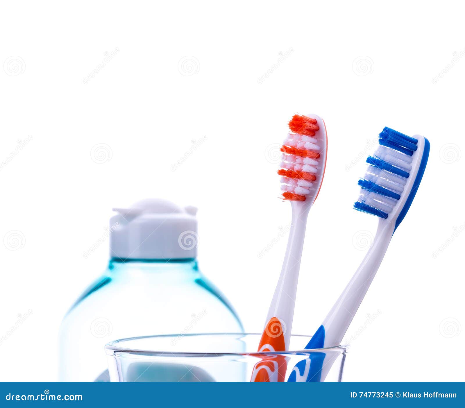 Toothbrushes in Water Glass with Cosmetics Bottle Stock Image - Image ...