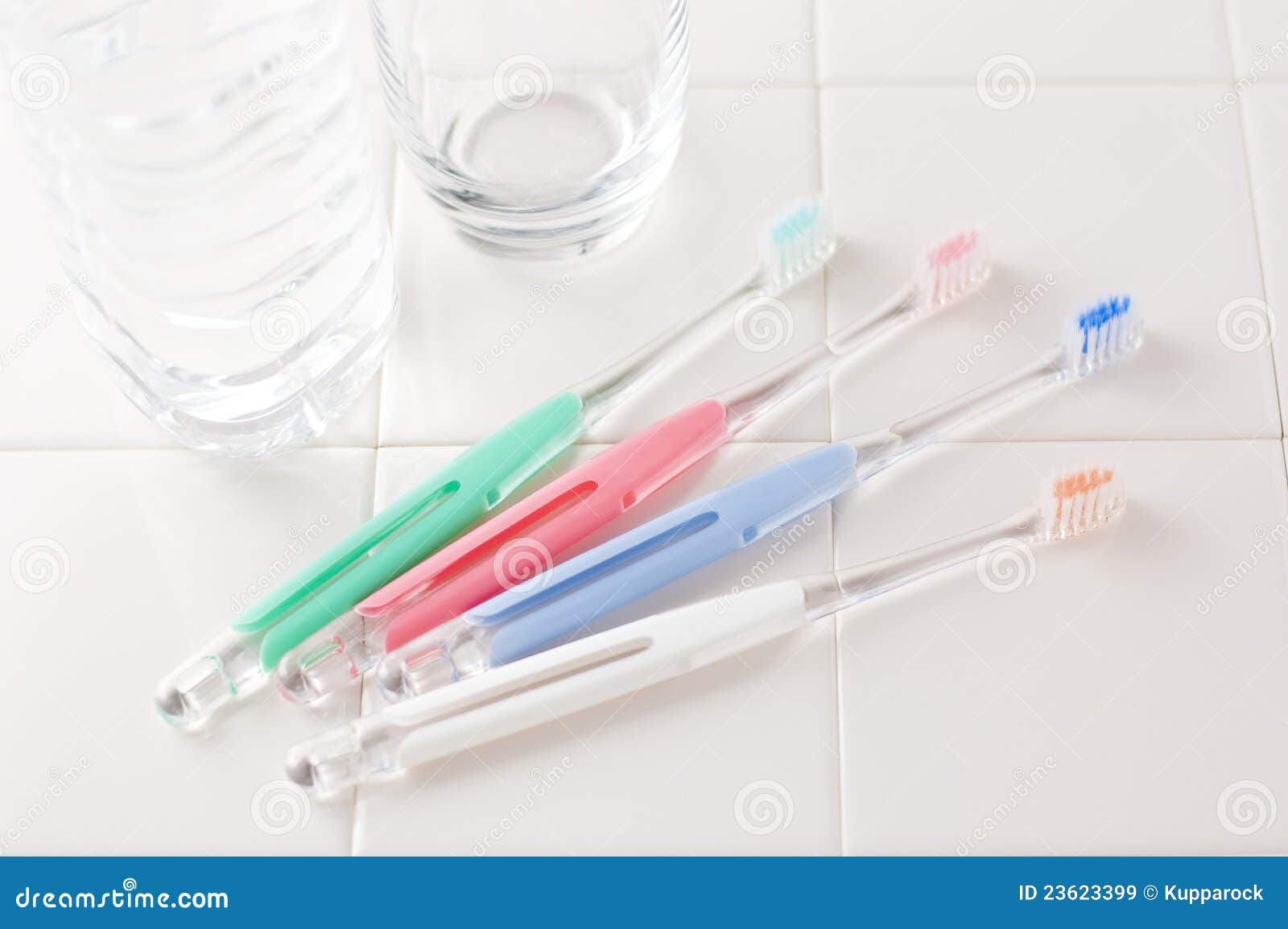 Toothbrushes on white tile stock image. Image of plastic - 23623399