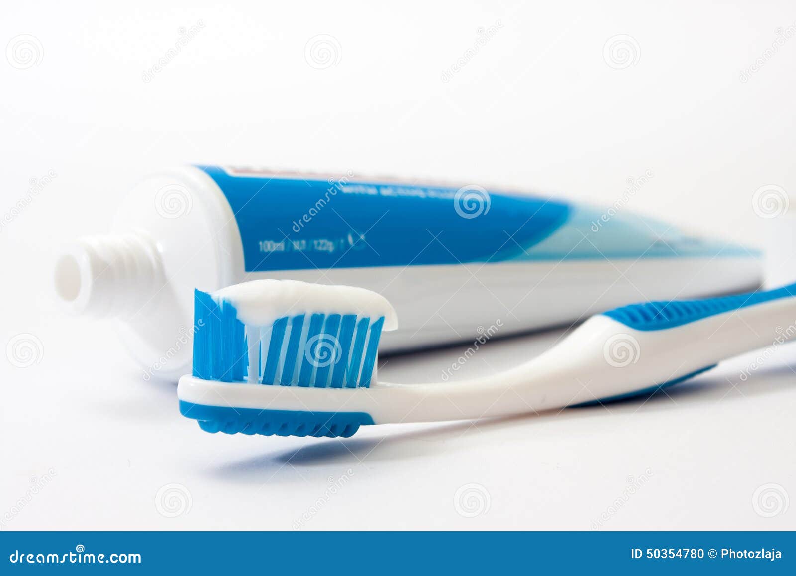 Toothpaste on a Toothbrush with a Tube Stock Photo - Image of ...