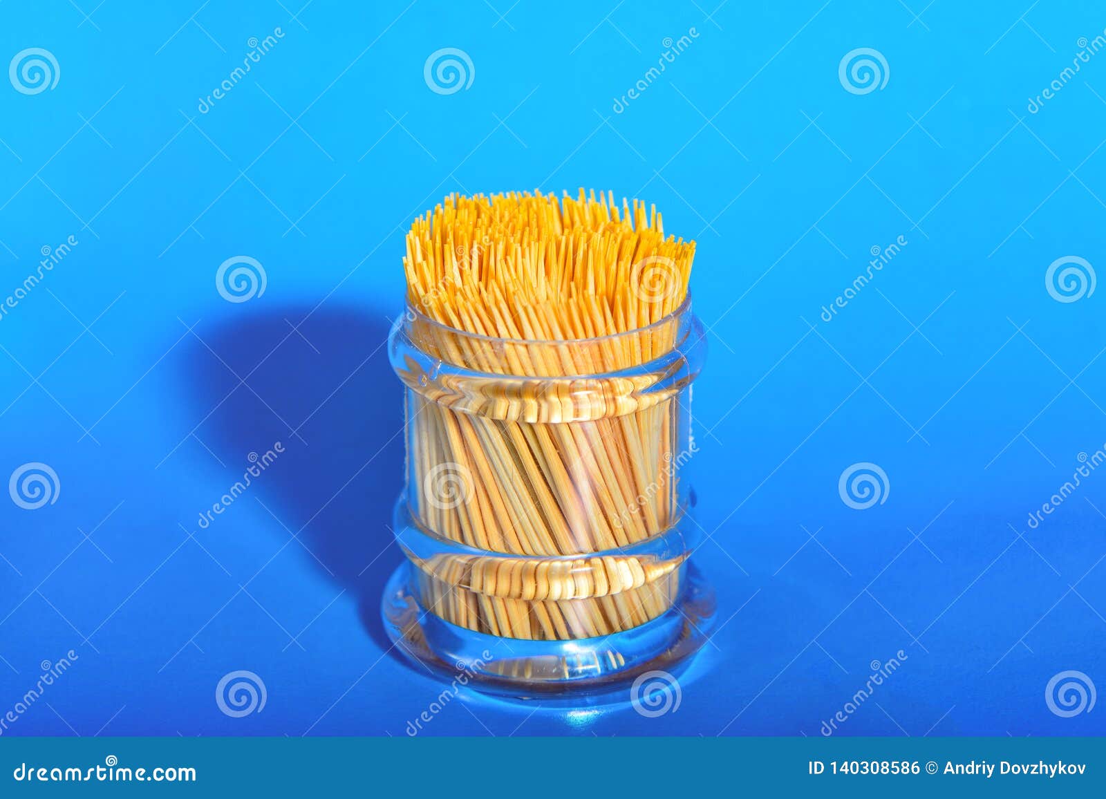Toothpicks in Plastic Containers on a Blue Background Stock Photo ...