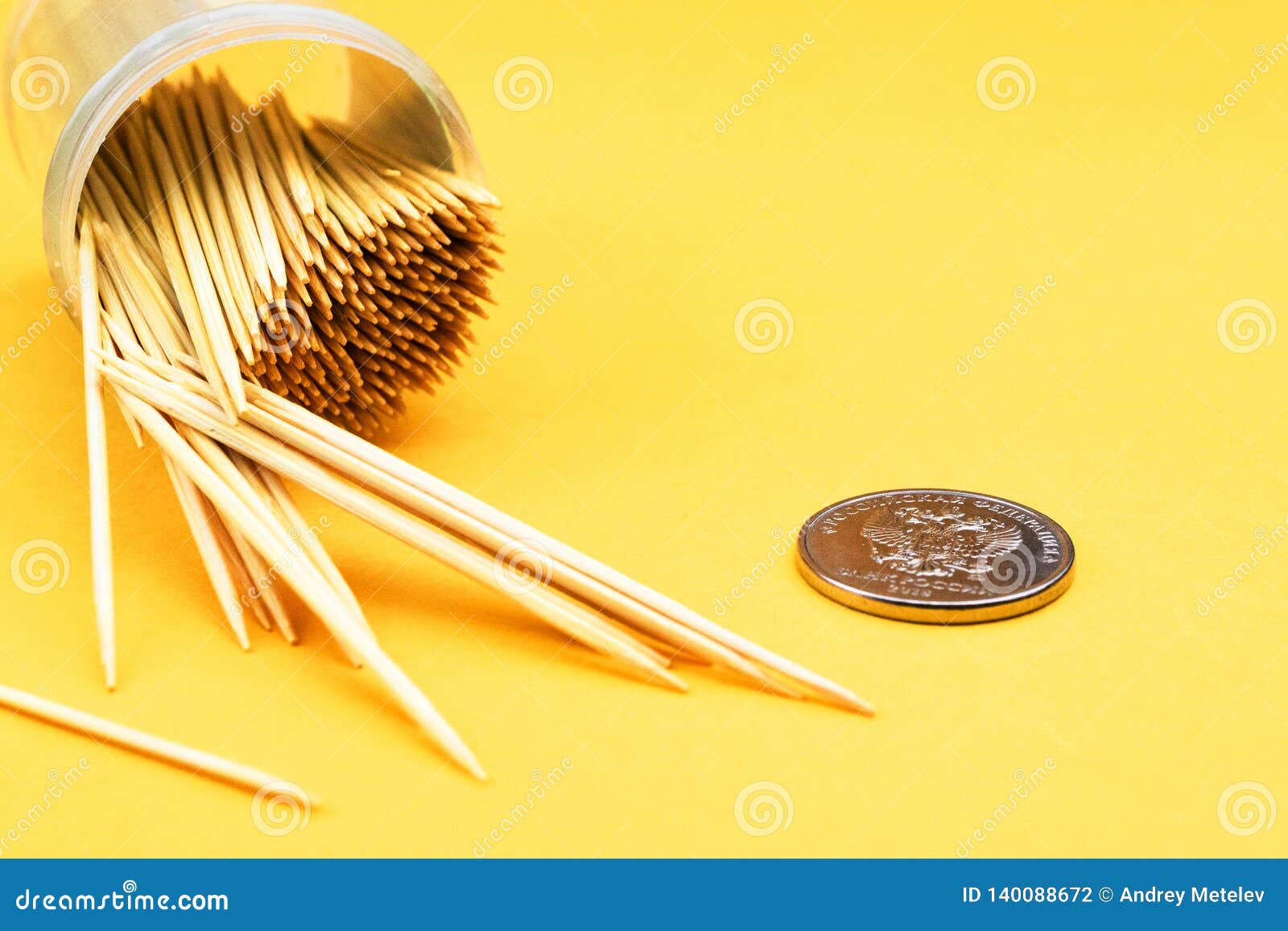 Toothpicks on a Yellow Background Scattered on the Table and an Iron ...