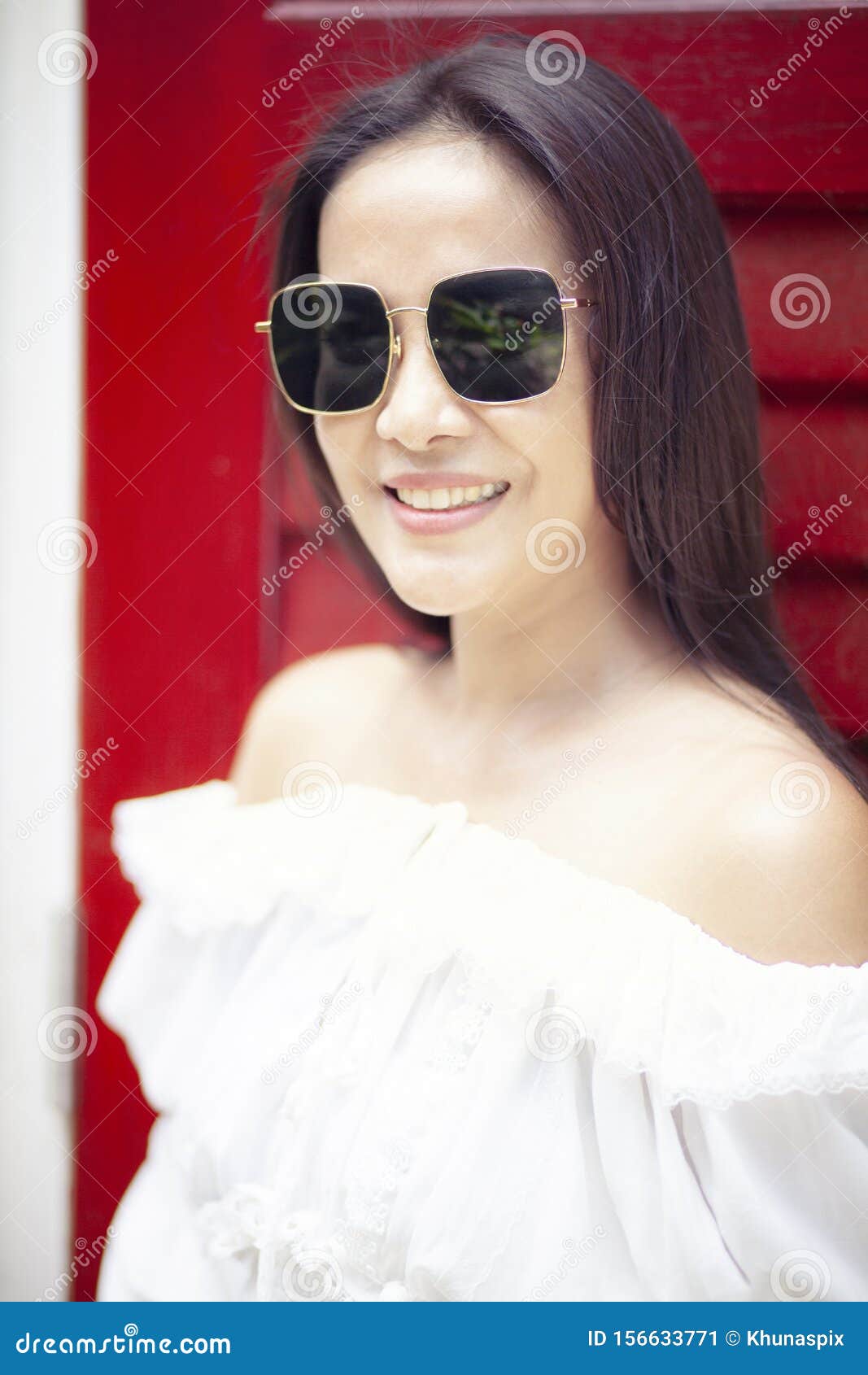 Toothy Smiling Face of Beautiful Asian Younger Woman Wearing Sunglasses ... Toothy Smiling Face of Beautiful Asian Younger Woman Wearing Sunglasses ...