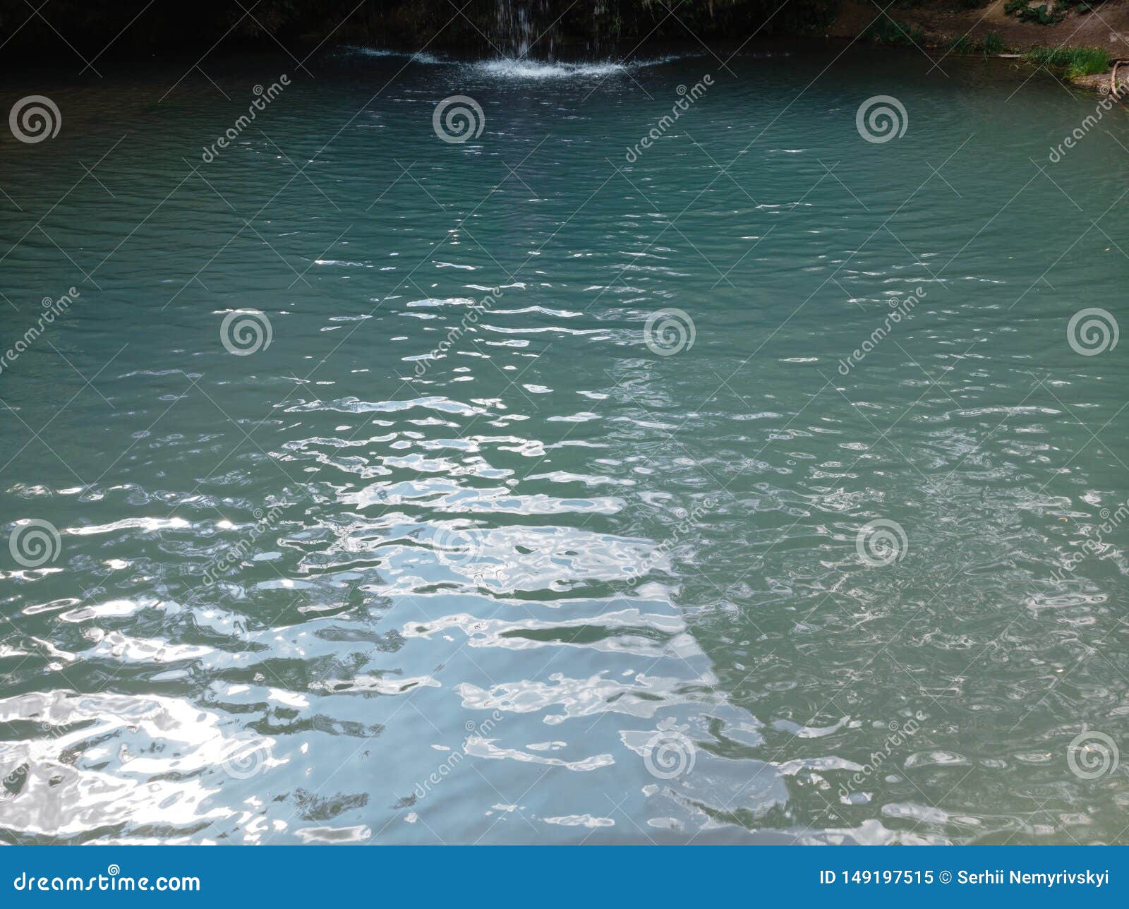 Top Aerial Wide View Of Paradise Water Glas Surface In Deep Forest Blue