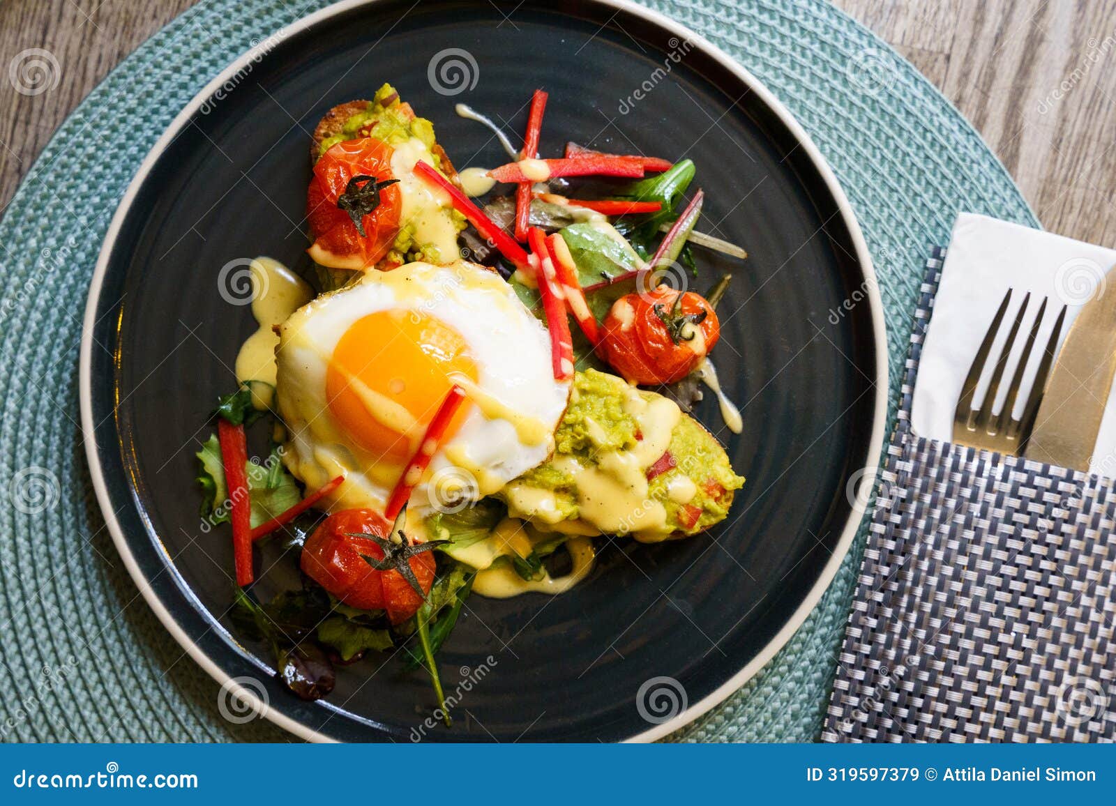 Top Down of Avocado Toast with Fried Eggs and Vegetables Stock Image ...