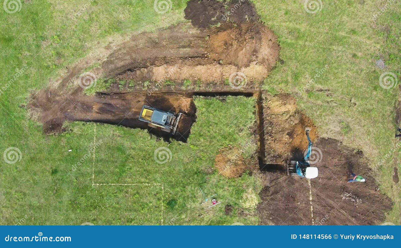 Top Down of Bulldozer and Excavator Digging Pit According To Marking on ...