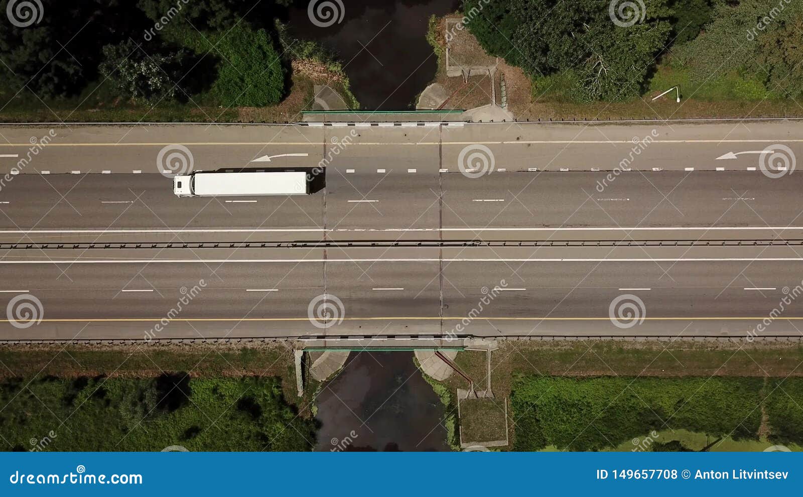 Top Down Close Up of Highway, White Arrow Signs Indicating Direction ...