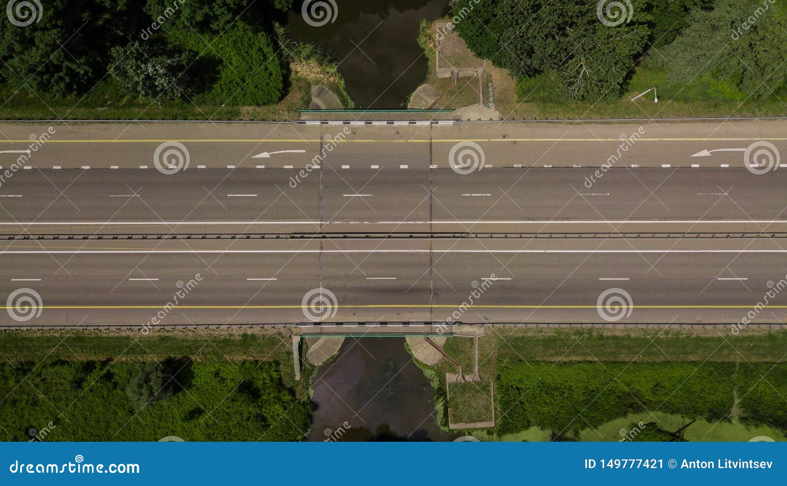 Top Down Close Up of Highway, White Arrow Signs Indicating Direction ...
