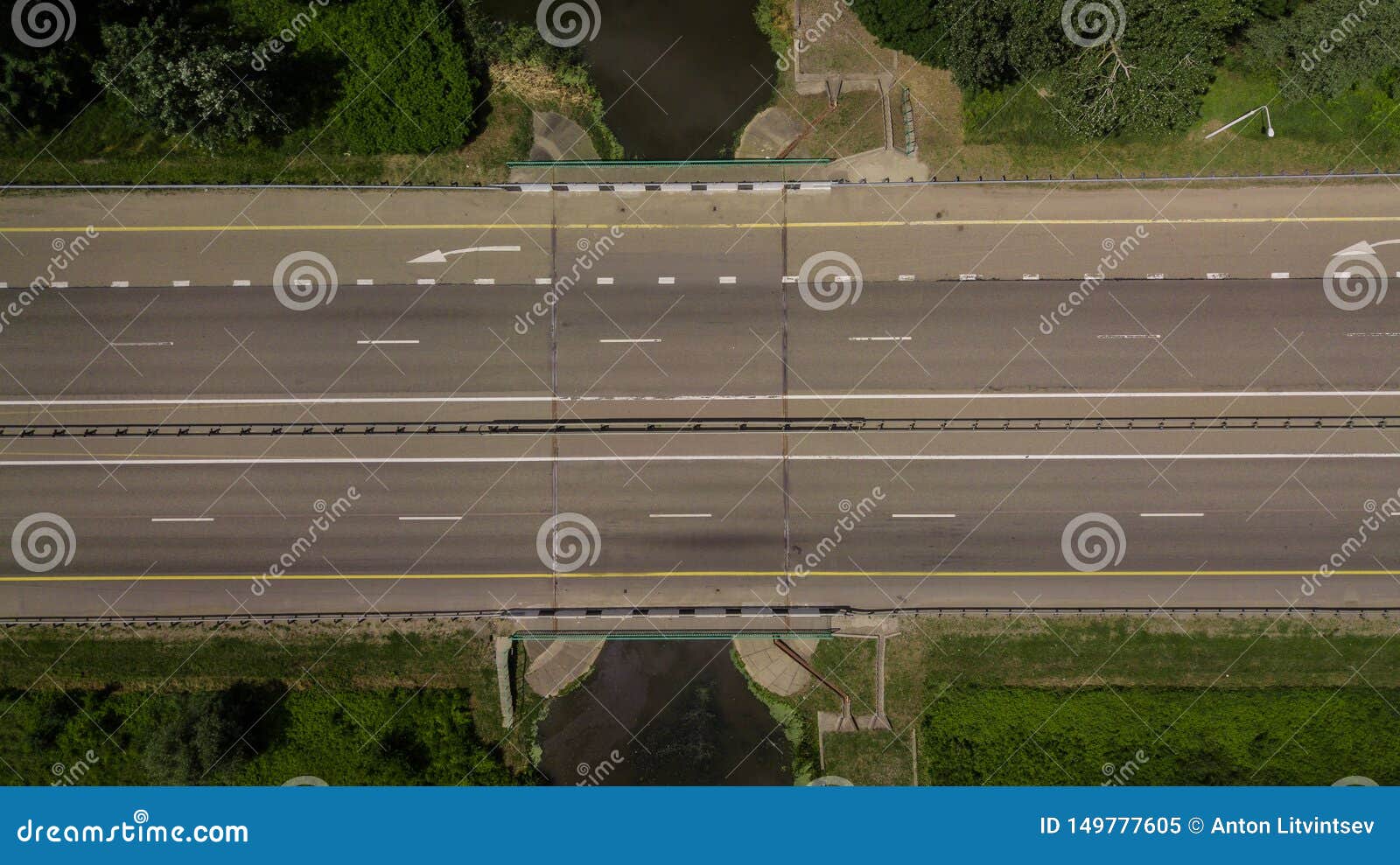 Top Down Close Up of Highway, White Arrow Signs Indicating Direction ...