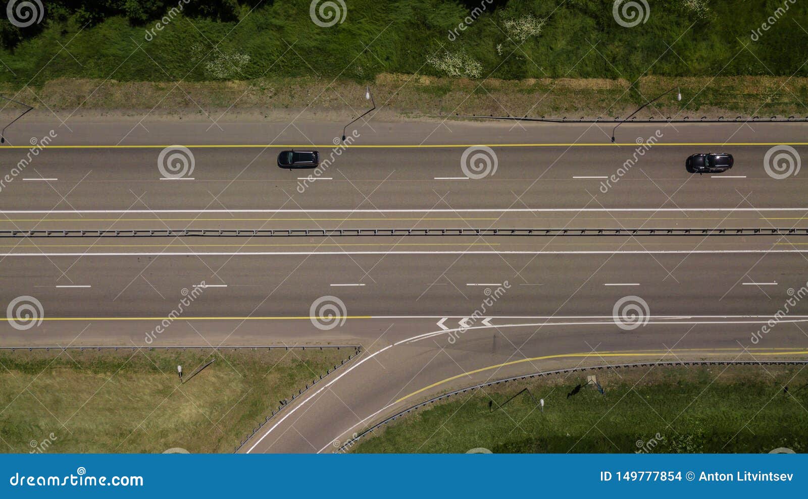 Top Down Close Up of Highway, White Arrow Signs Indicating Direction ...