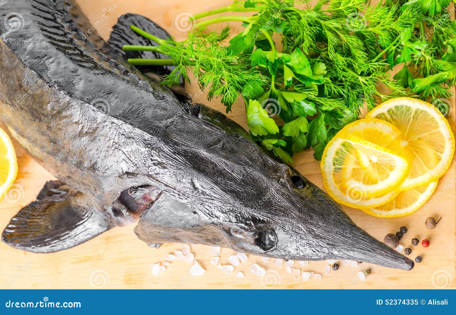 Top Down of Fresh Raw Sturgeon Fish with Greens, Lemon, Differen Stock ...
