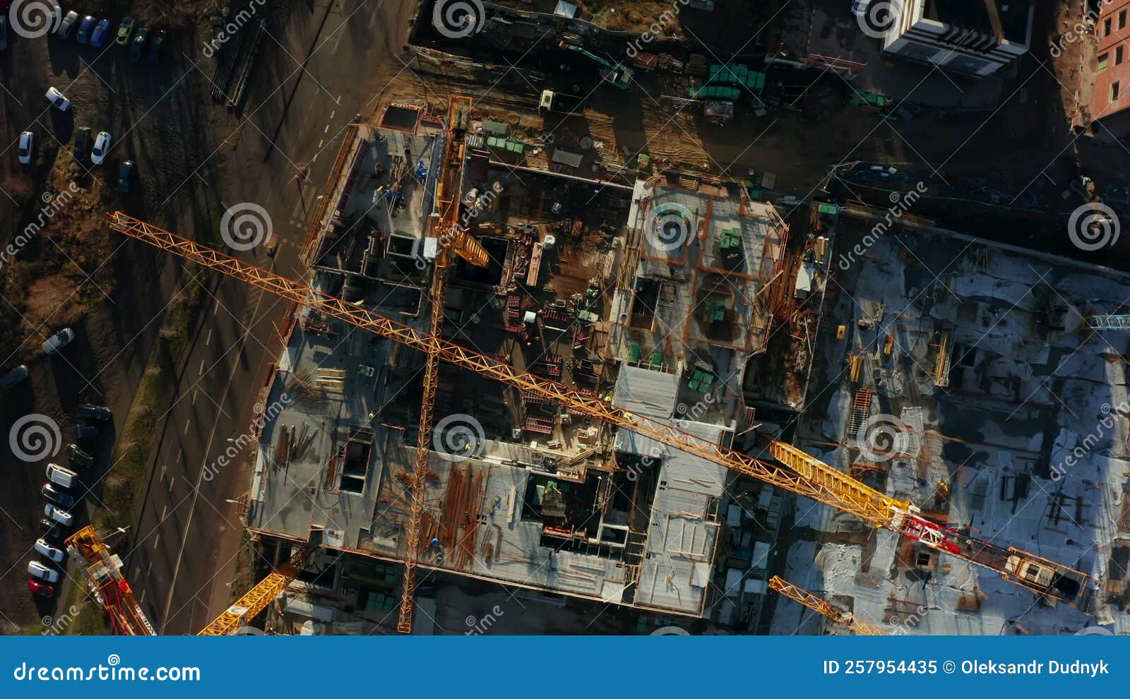 Top Down View of Building Construction with Tower Cranes and Workers ...