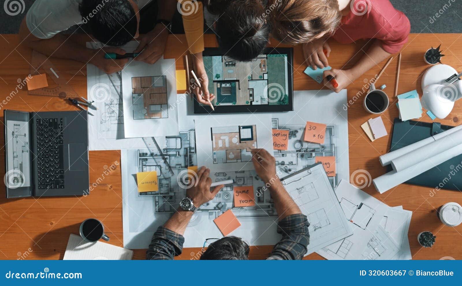 Top Down View of Civil Engineer Planning and Writing at Blueprint ...