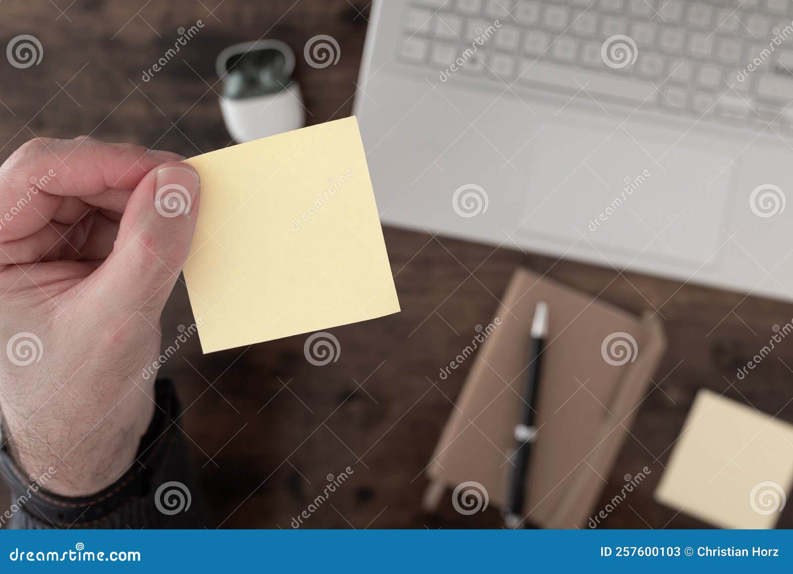 Top Down View of Hand Holding Empty Yellow Sticky Note Stock Image ...