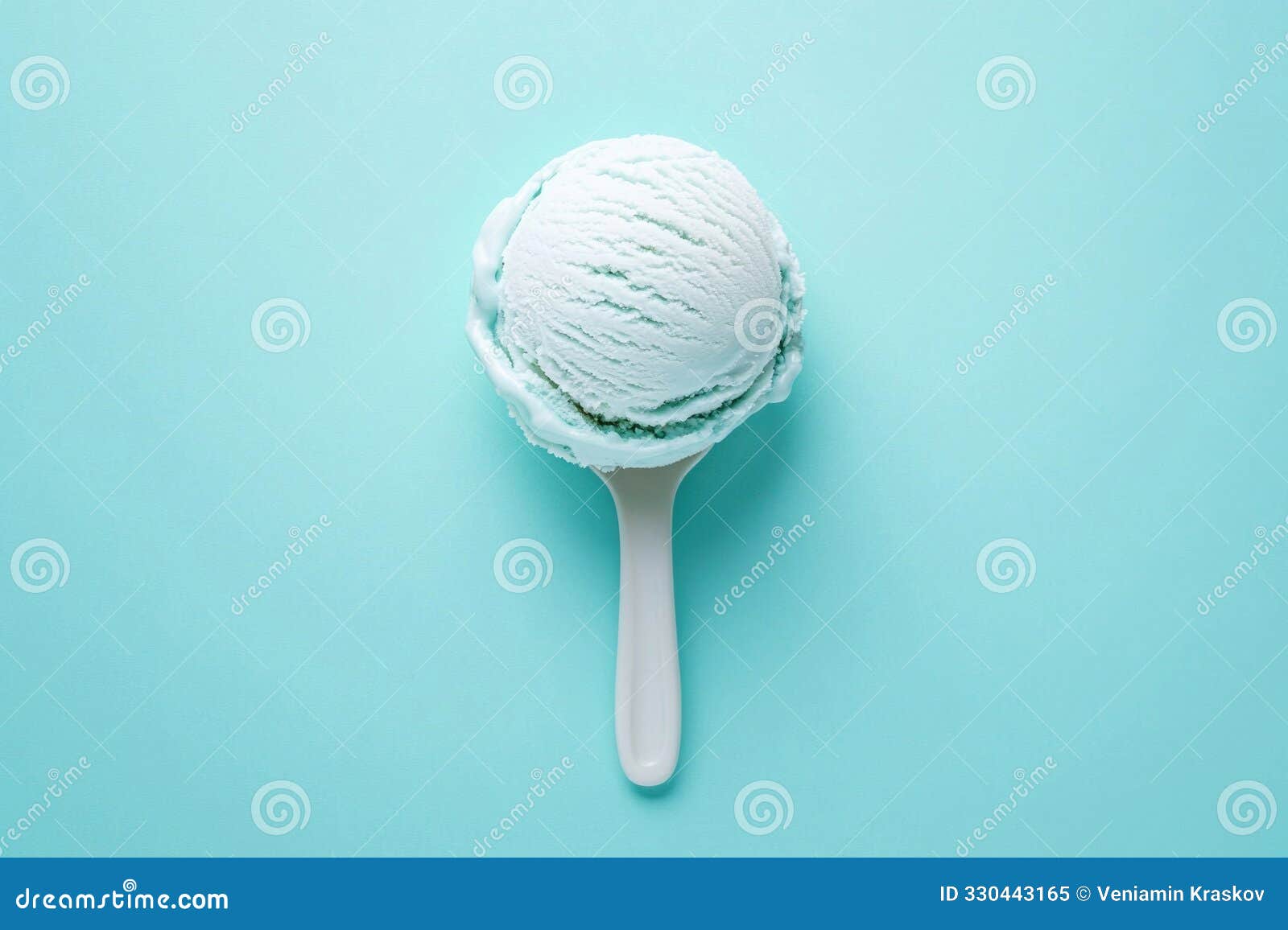 A Top-down View of a Light Blue Ice Cream Scoop on a Light Blue ...