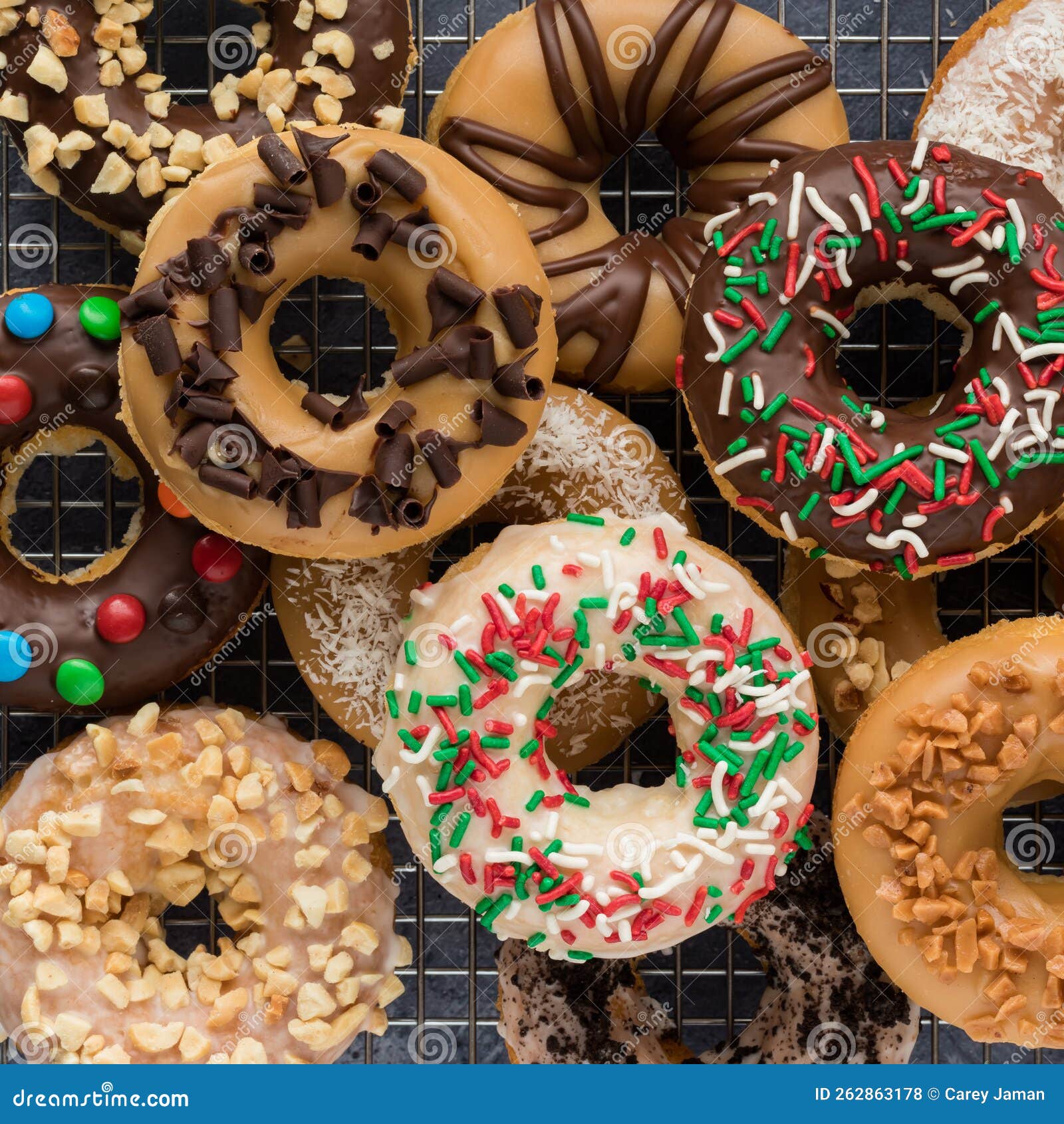 Top Down View of a Pile of Fresh Homemade Donuts with Various Toppings ...