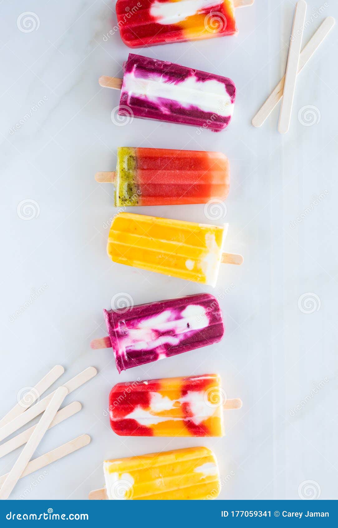 A Top Down View of a Row of Various Homemade Fresh Fruit Popsicles ...