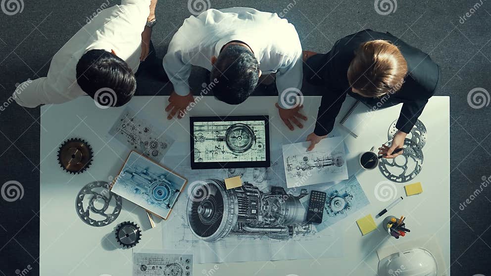 Top View of Engineer Working Together while Looking at Jet Engine ...