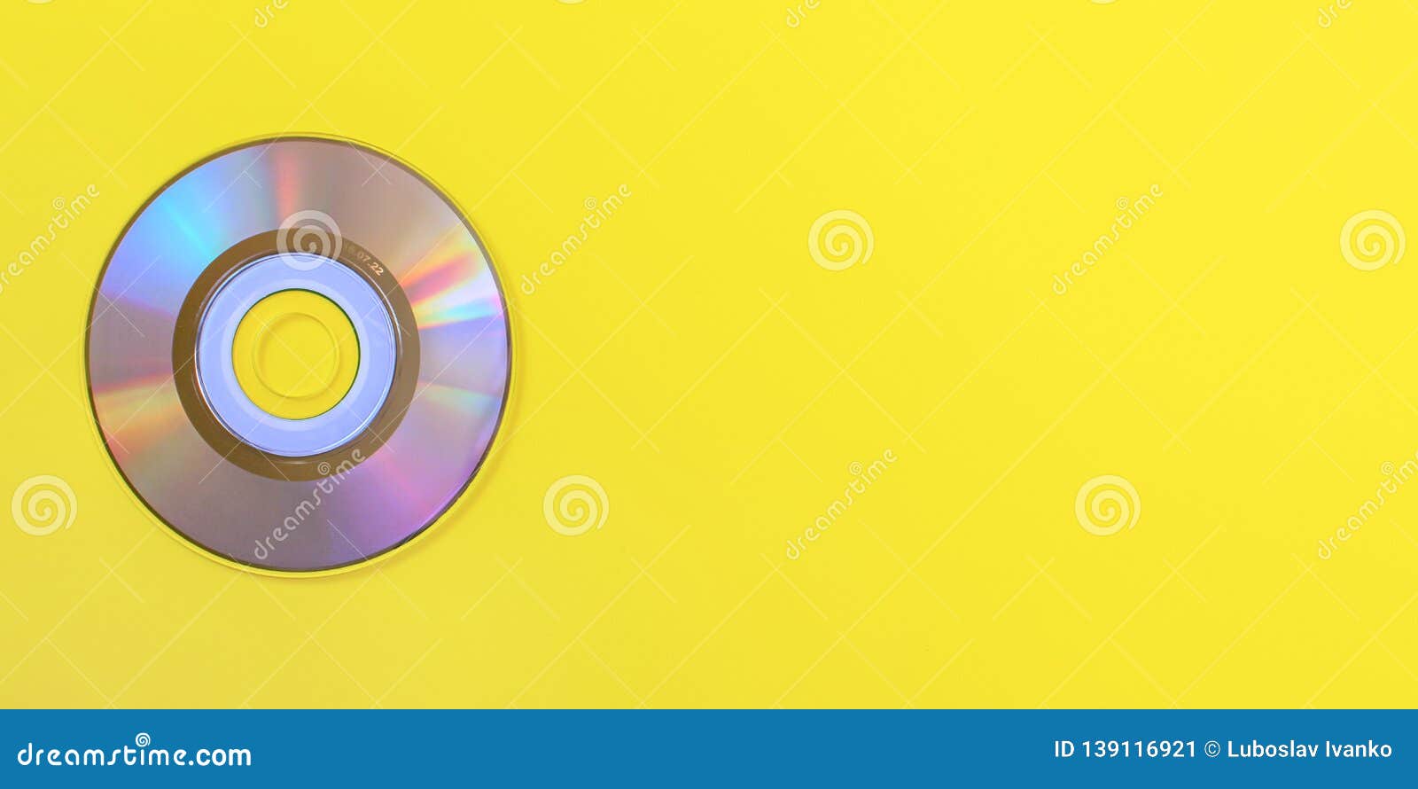 Top Down View, Small CD Shiny / Rainbow Side, on Yellow Board, Space ...