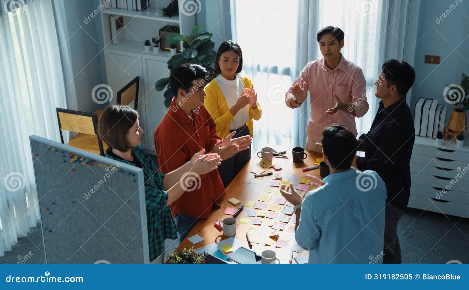 Top Down View of Team Clapping Hands To Celebrate Increasing Sales ...