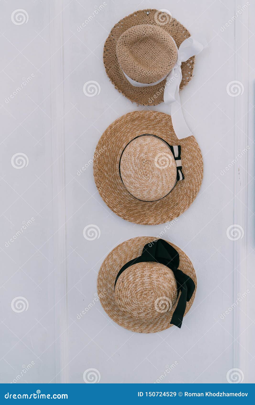 Top Down View of Three Straw Hats with Bows on White Background Stock ...