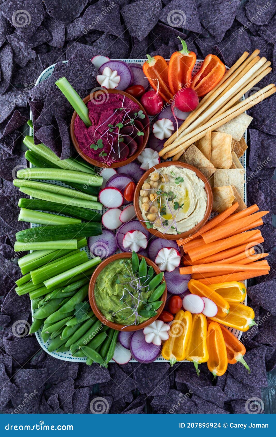 Top Down View of a Vegetable Charcuterie Board with Three Hummus Dips ...