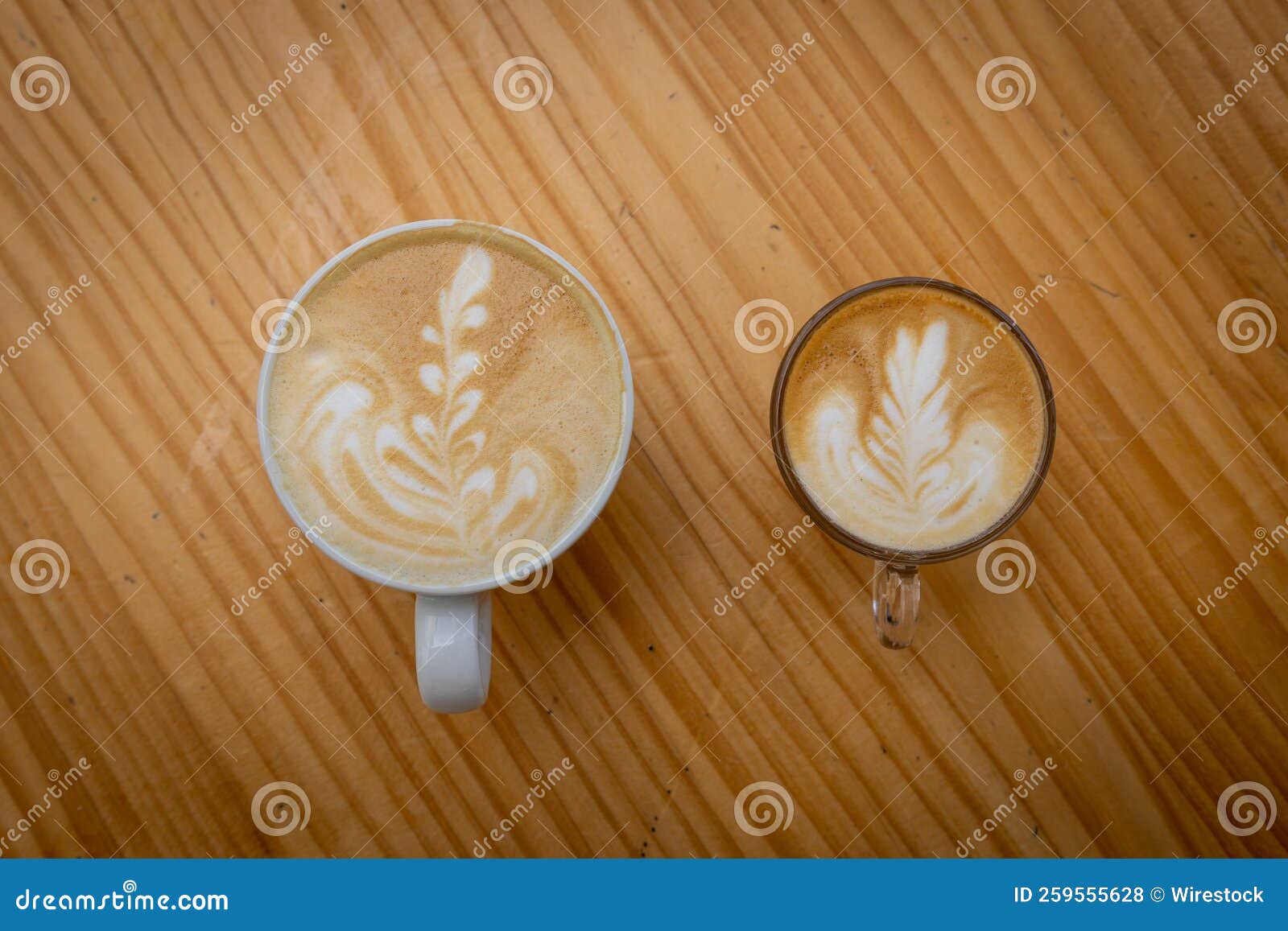 Top Shot of Two Cappuccinos on a Wooden Table Stock Photo - Image of ...