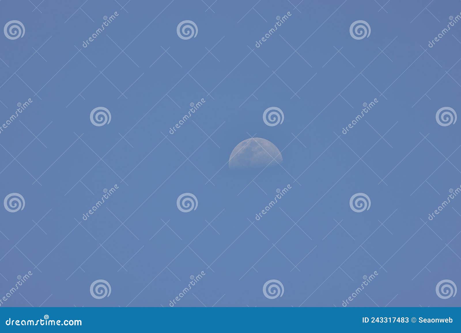 A Top Side of a Bright Half Moon Far Away in the Clear Blue Sk Stock ...