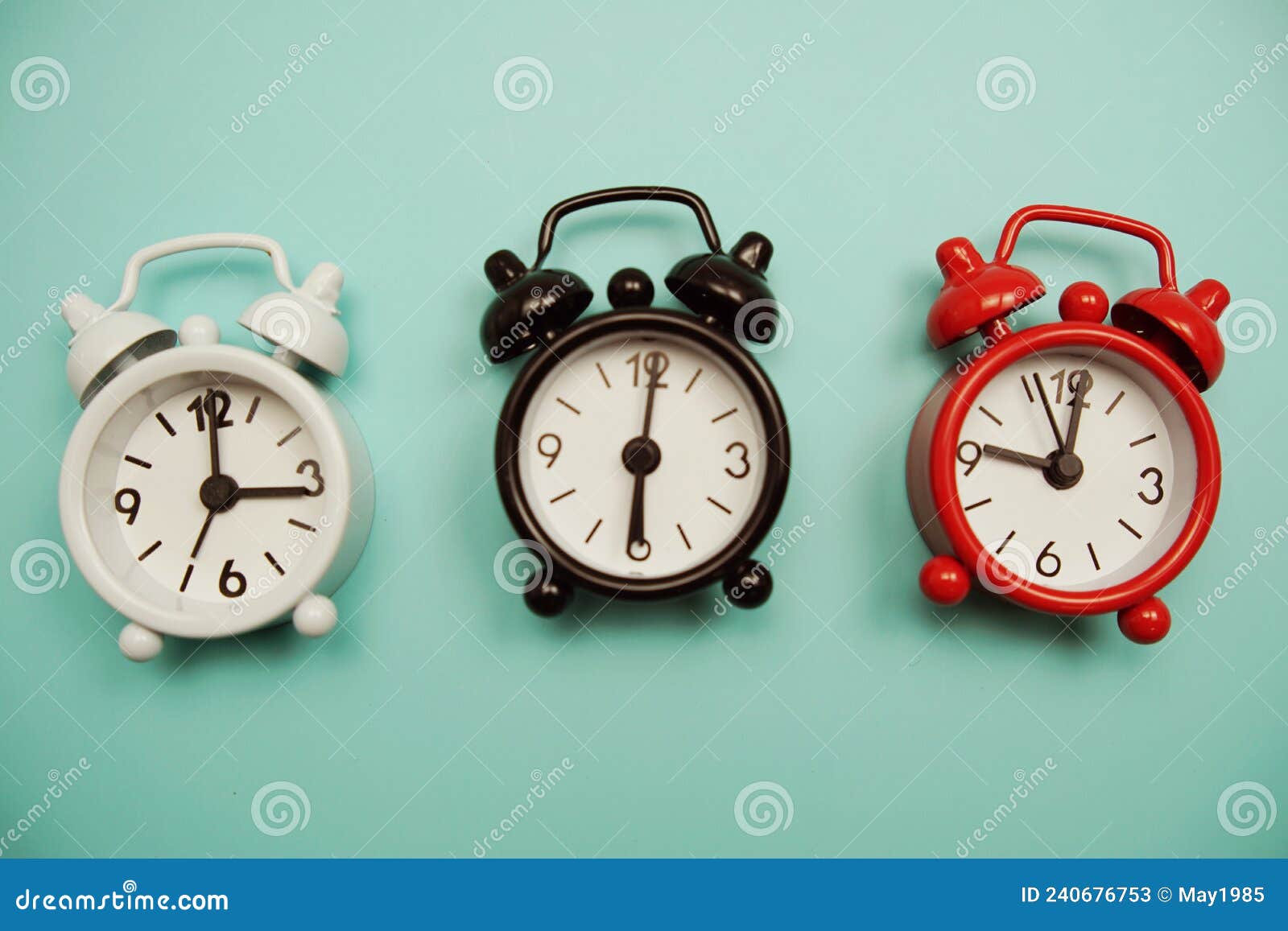 Alarm Clocks with Different Time Flat Lay Composition on Blue ...