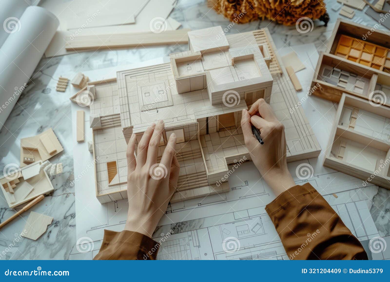 Top View of an Architect Drawing a Sketch and Assembling 3D Model of a ...