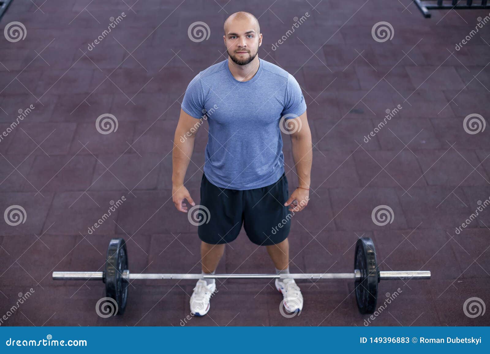Top View of a Athletic Man Works Out at the Gym with a Barbell Stock ...
