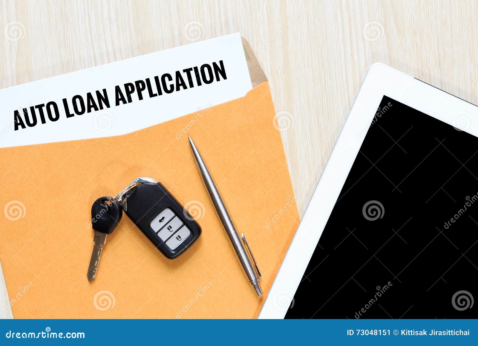 Top View of Auto Loan Application in Envelope with Car Remote Key, Pen ...