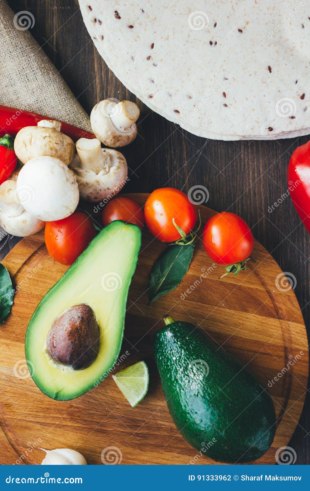 Top View of Avocado Standing on Wooden Board Surrounded by Vegetables ...
