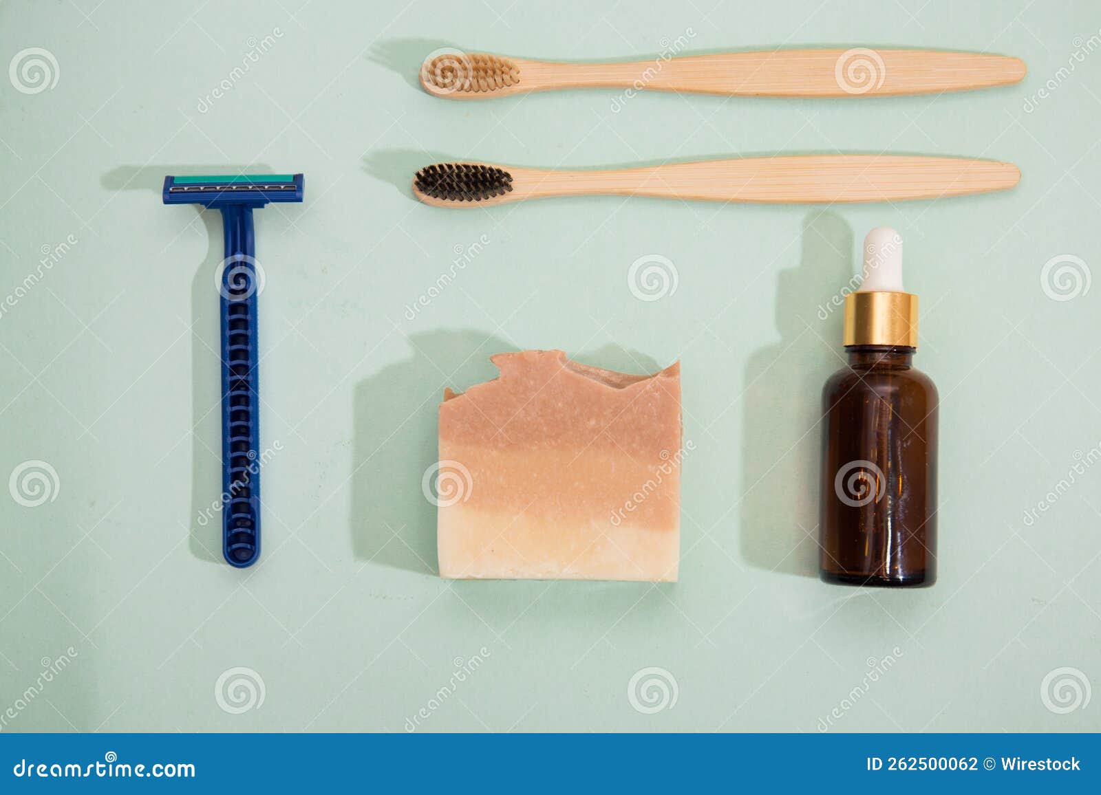 Top View of a Bar of Handmade Soap, Bamboo Toothbrushes, a Razor, and a ...