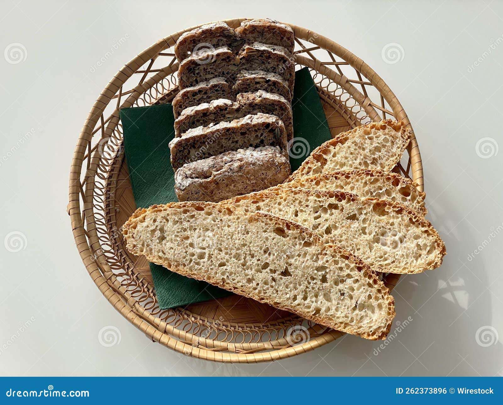 Top View of a Basket with Two Types of Bread on the White Table Stock ...