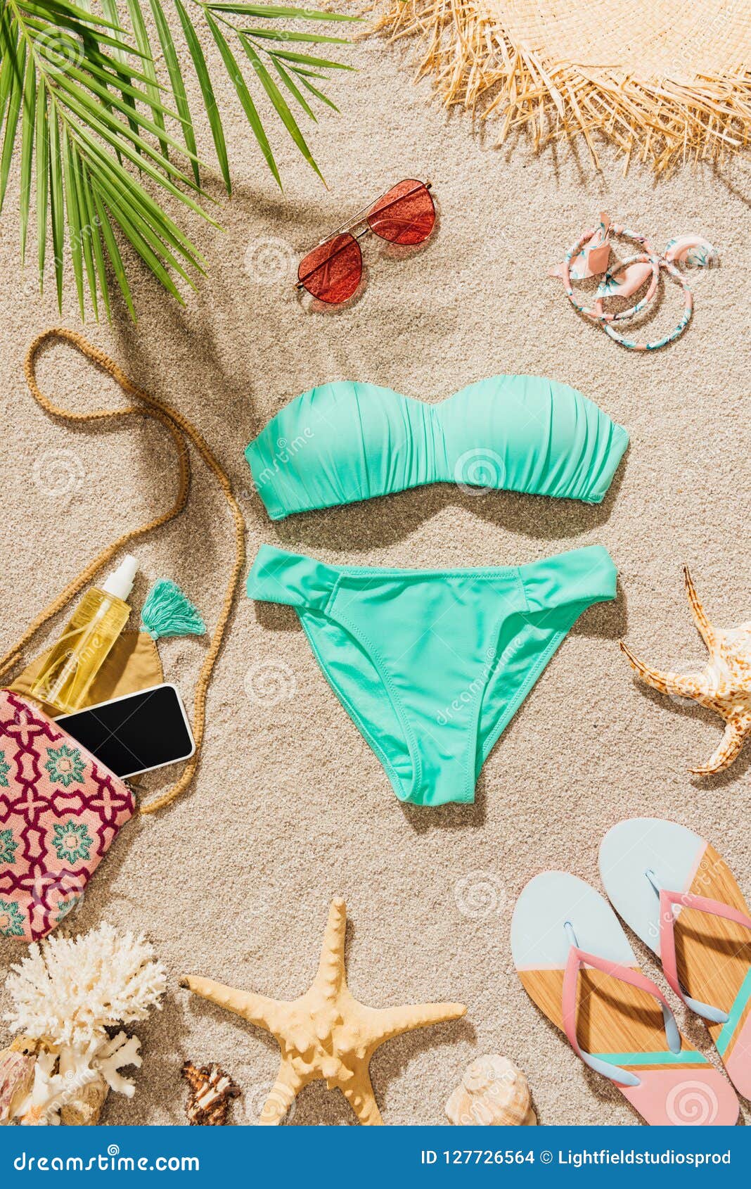 Top View of Beautiful Bikini and Various Accessories Lying on Sandy ...