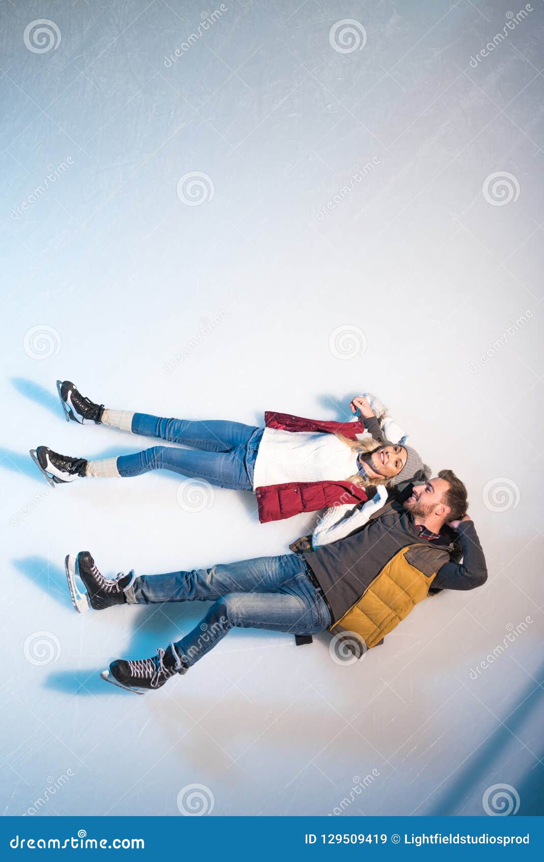 Top View of Beautiful Happy Young Couple Lying Together on Ice of Stock ... Top View of Beautiful Happy Young Couple Lying Together on Ice of Stock ...