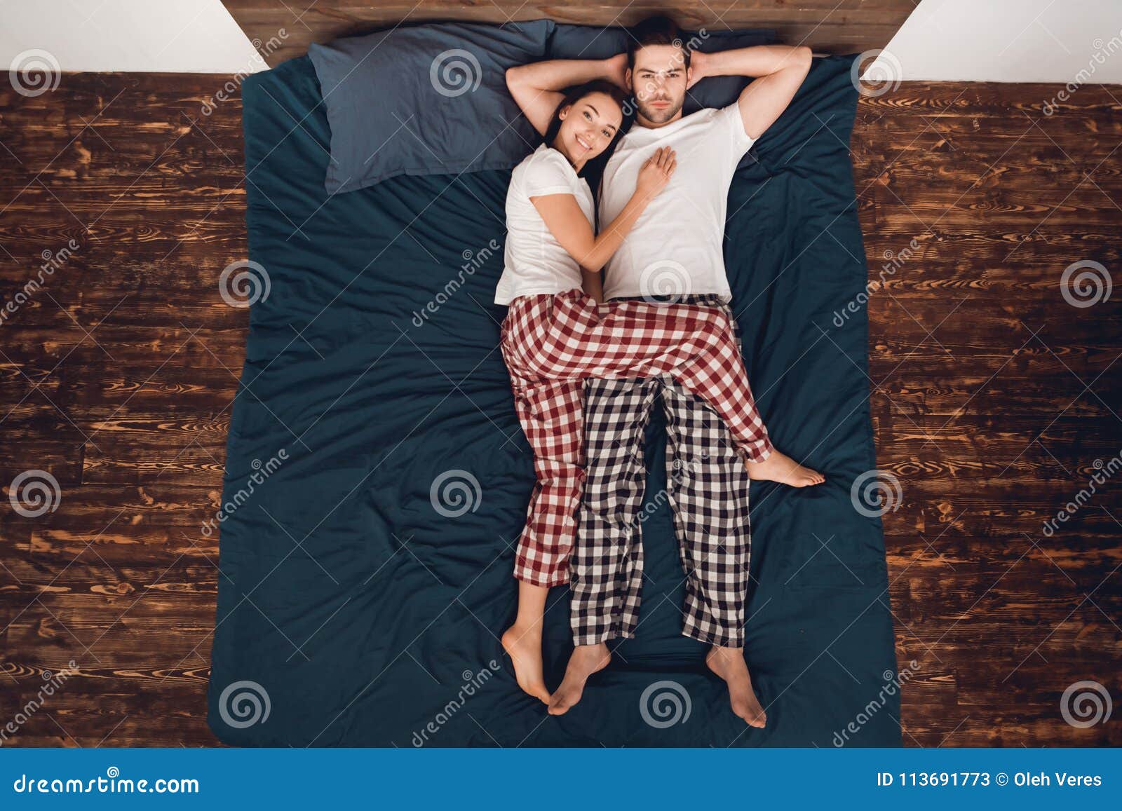 Top View. Beautiful Young Woman is Lying Next To Handsome Man. Sleep ... Top View. Beautiful Young Woman is Lying Next To Handsome Man. Sleep ...