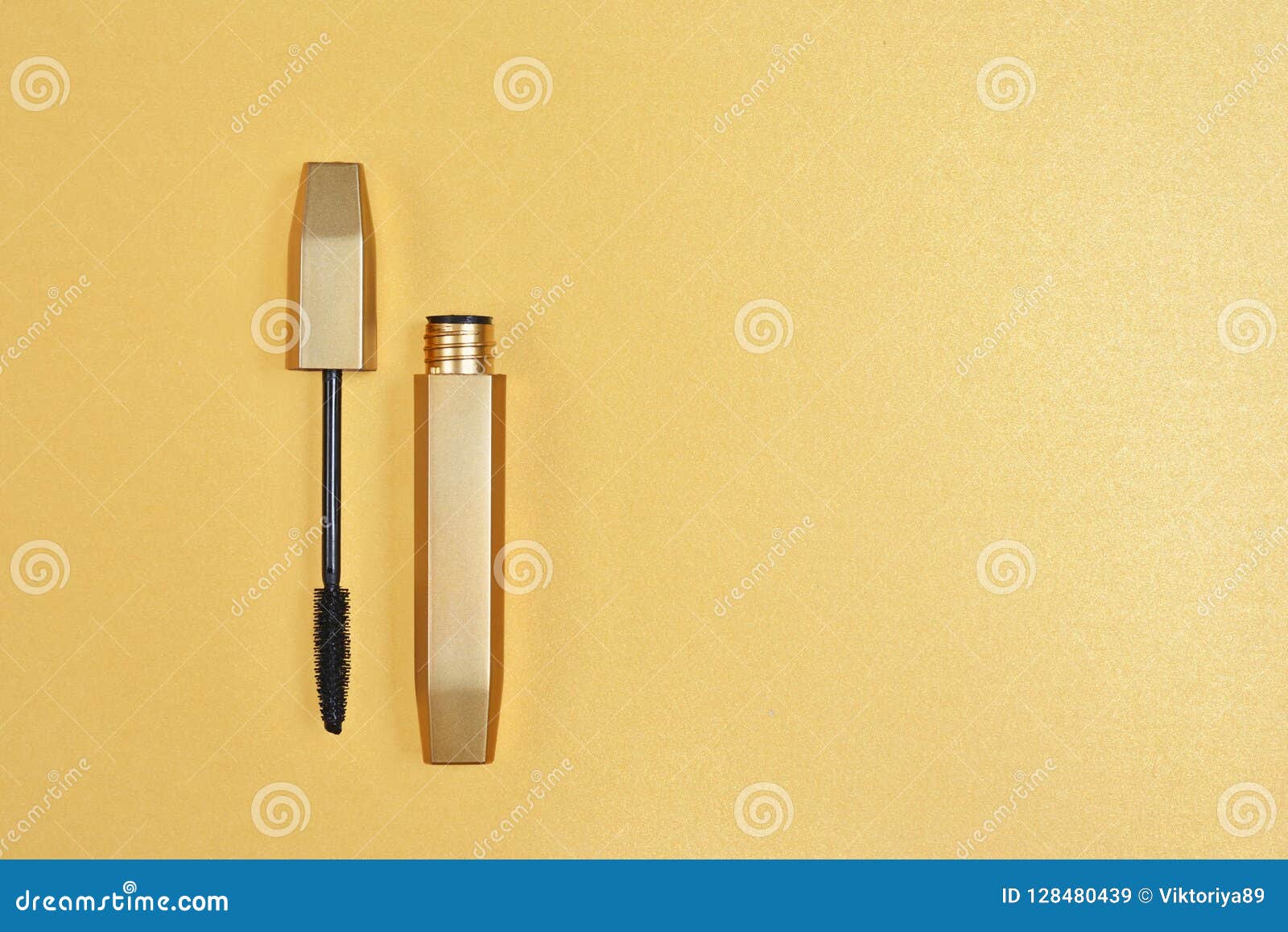 Top View on Black Mascara for Makeup on Golden Background Stock Image ...