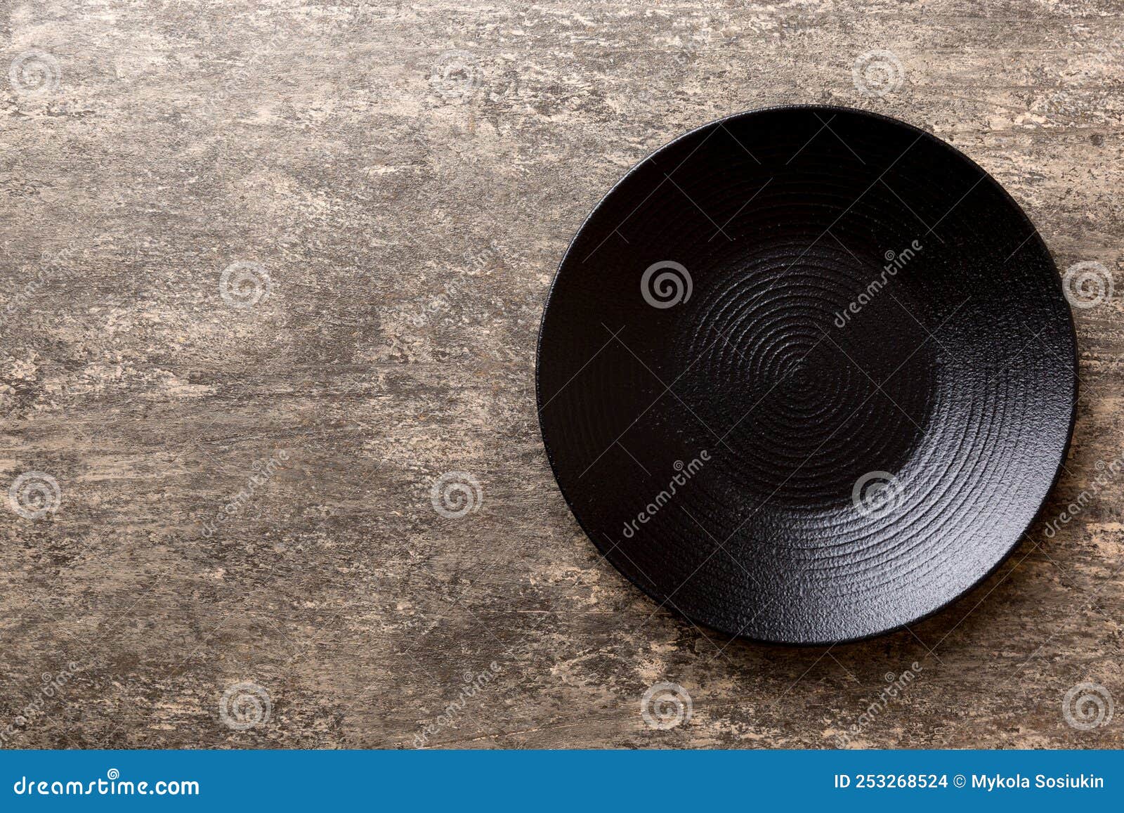 Top View of Black Plate on Cement Background. Empty Space for Your ...