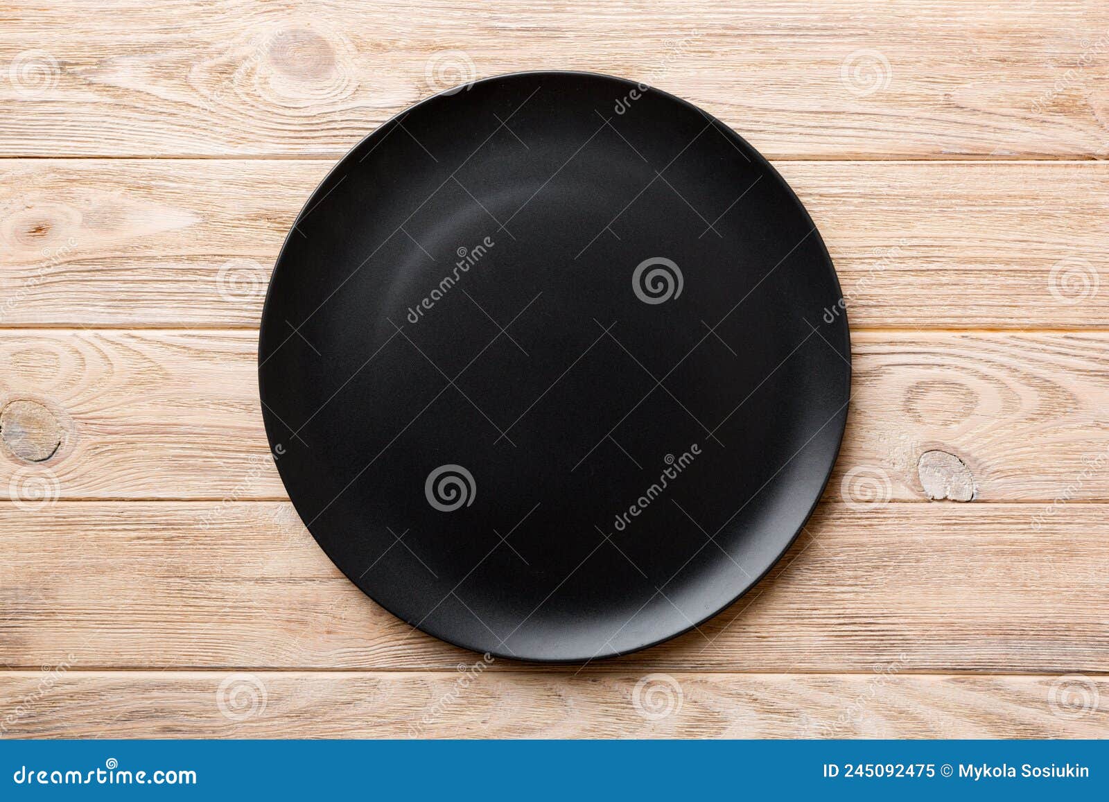 Top View of Black Plate on Wooden Background. Empty Space for Your ...