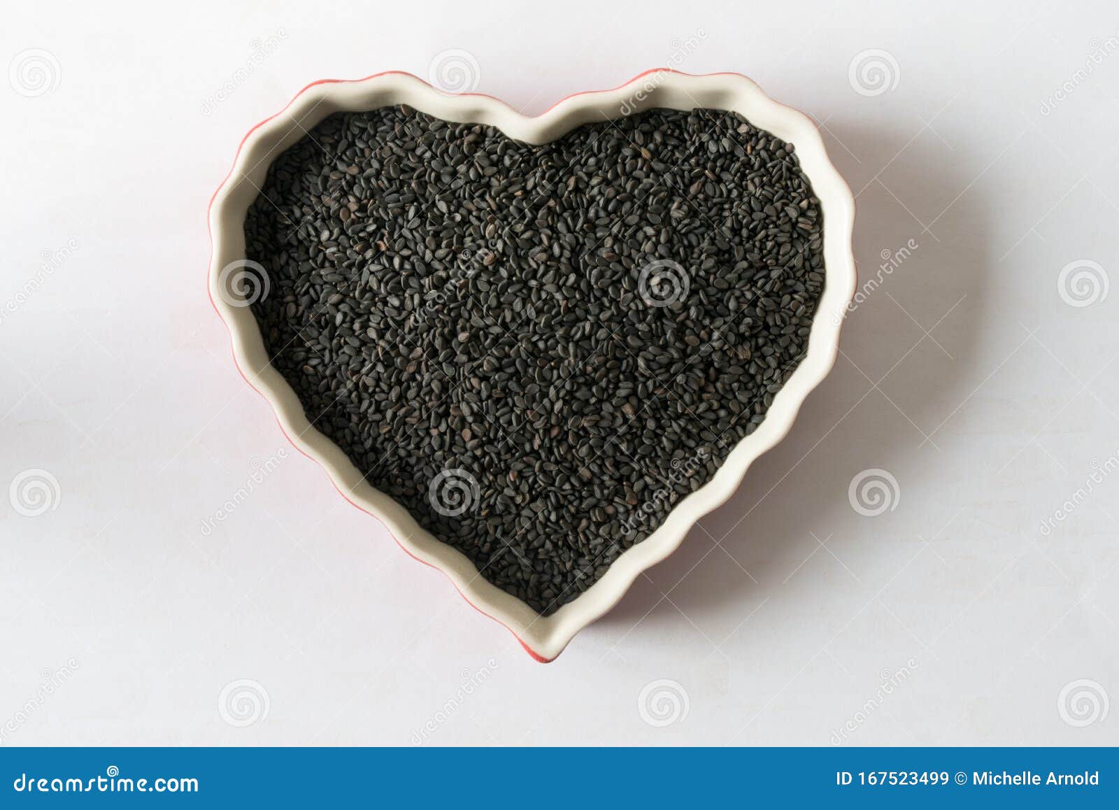 Black Sesame Seeds in a Heart Shaped Bowl` Stock Image - Image of ...