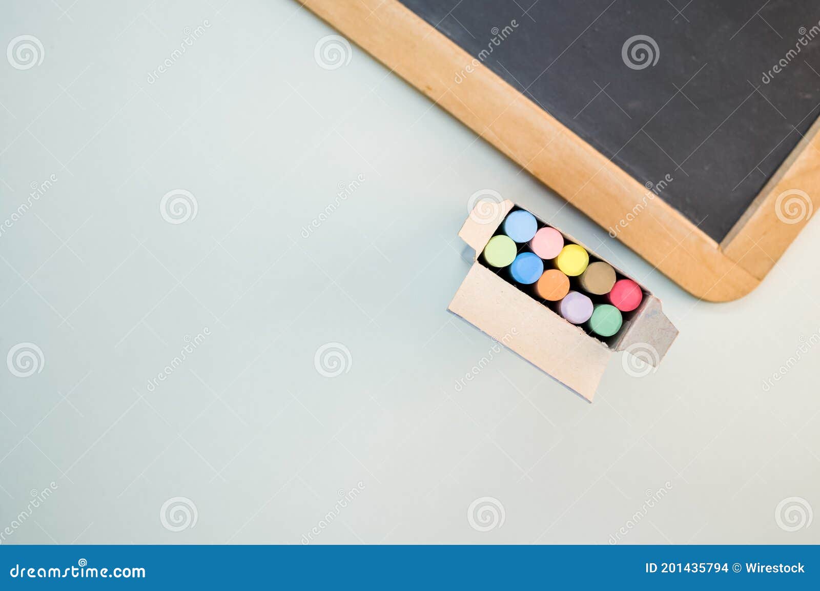 Top-view of a Blackboard with Colorful Chalks on a White Surface Stock ...