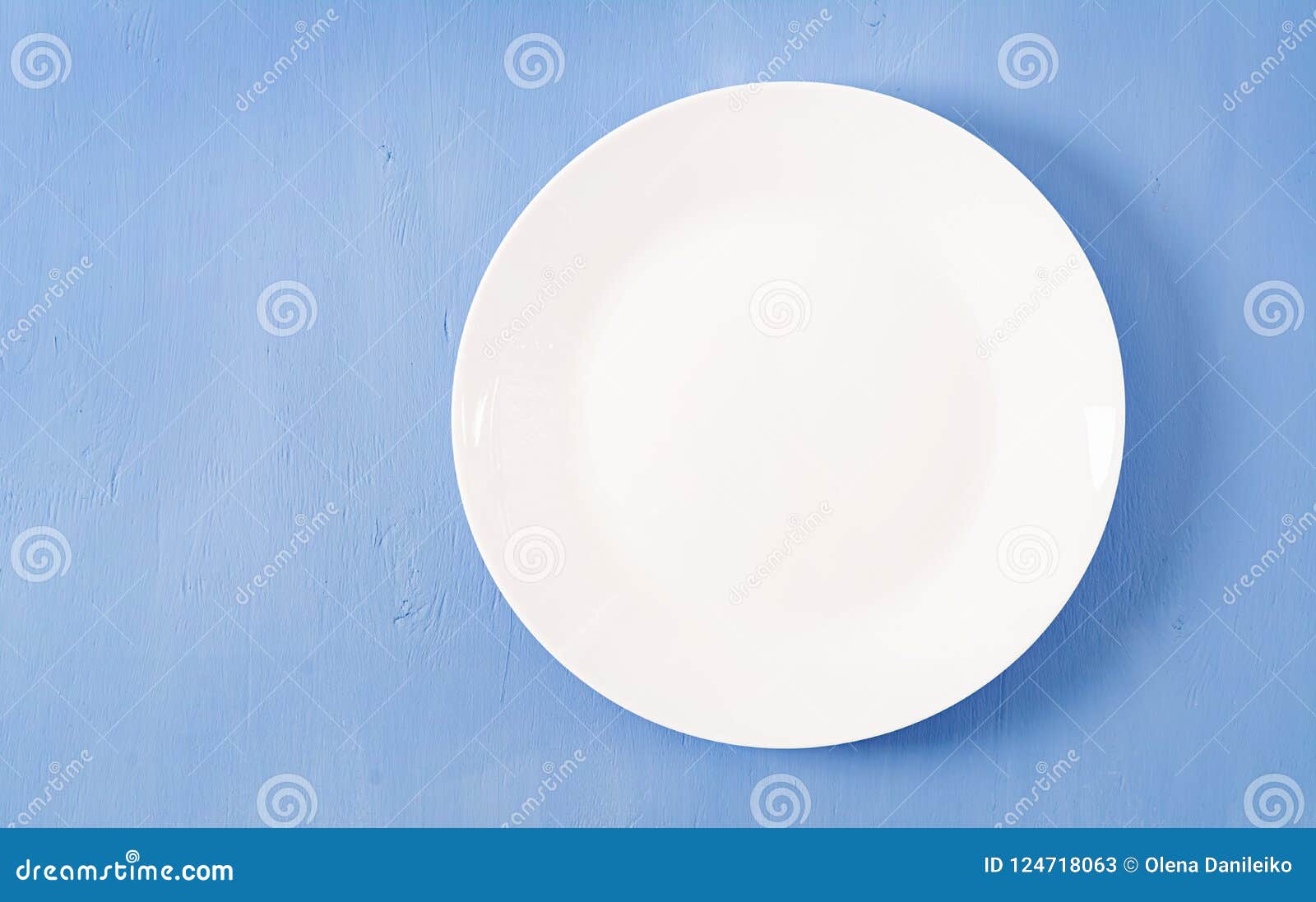 Top View of Blank White Dish on a Blue Background. Copy Space Stock ...