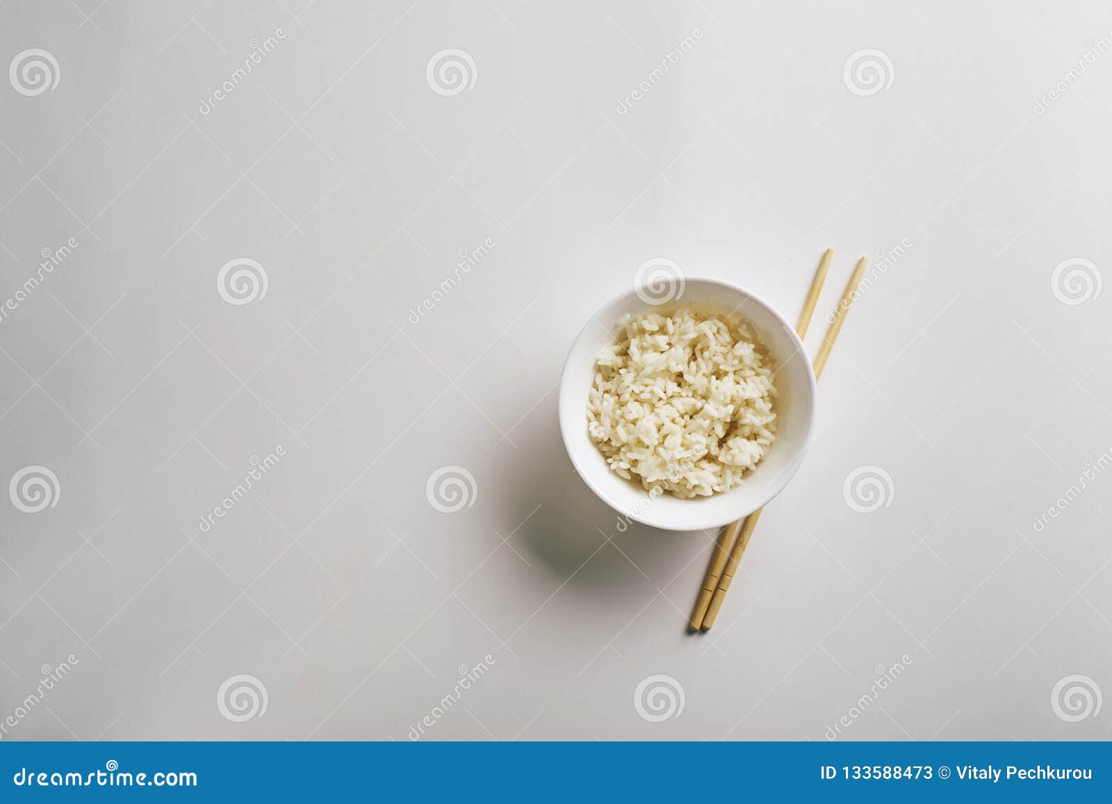 Top View of Boiled Rice with Chopsticks on a White Plate Isolated on ...