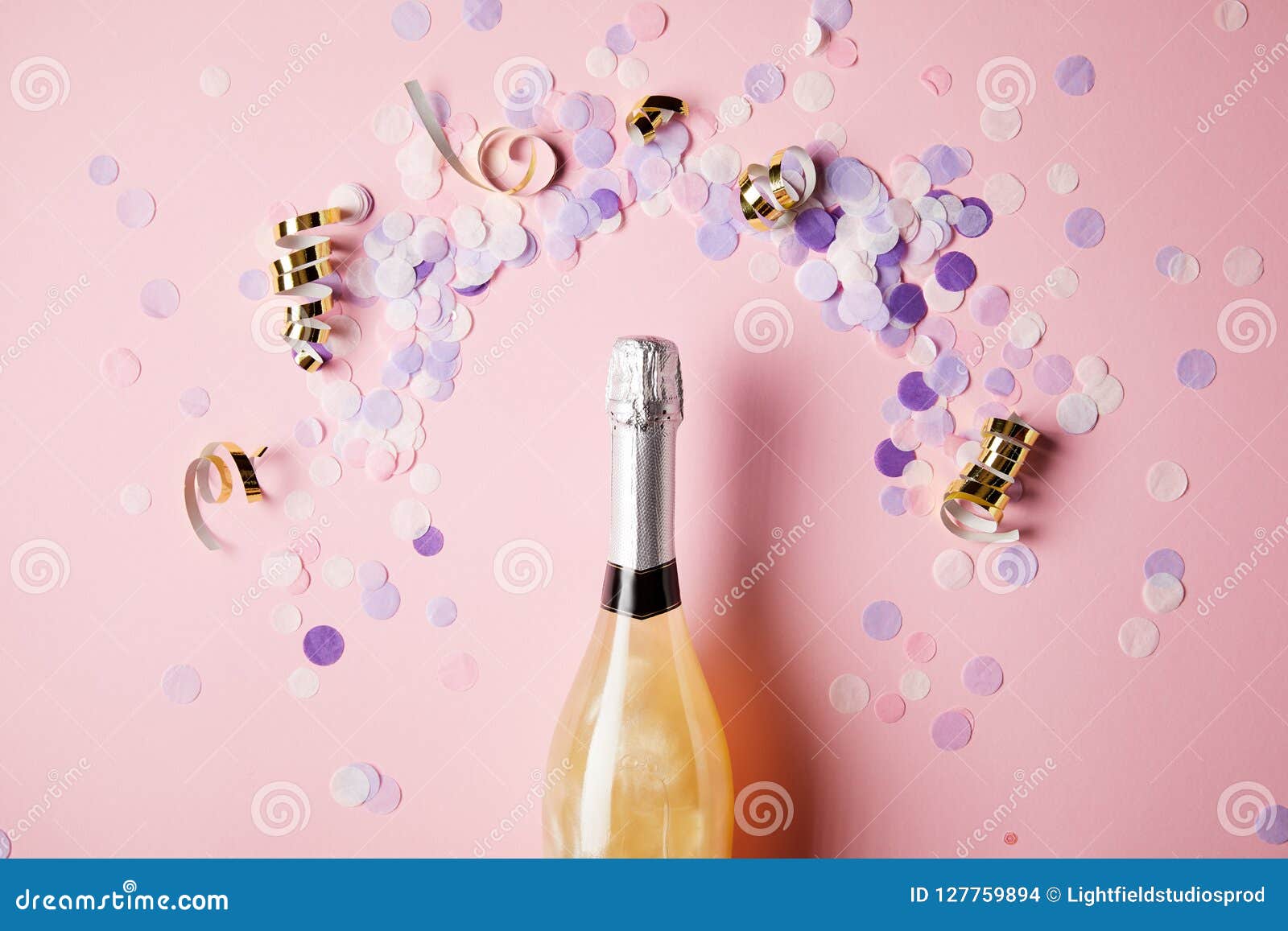 Top View of Bottle of Champagne and Confetti Pieces on Pink Surface ...