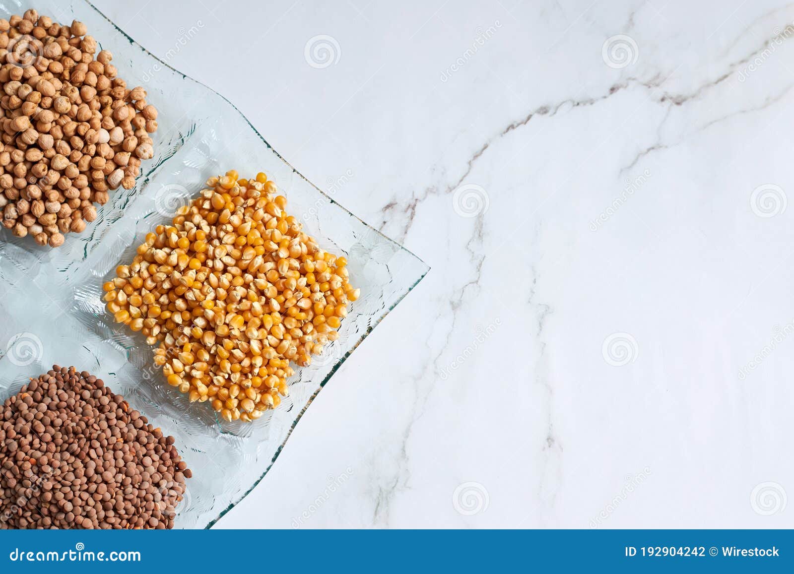 Top View of Brown Lentils, Corn Kernels, and Chickpeas in Four Separate ...