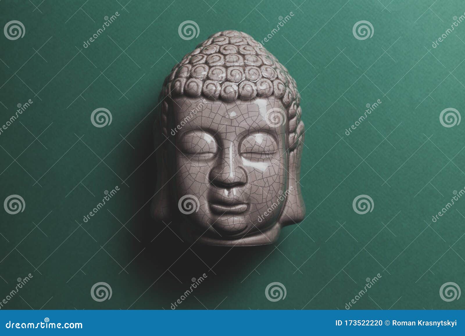 Top View of Buddha Head Statue on Green Background Stock Photo - Image ...