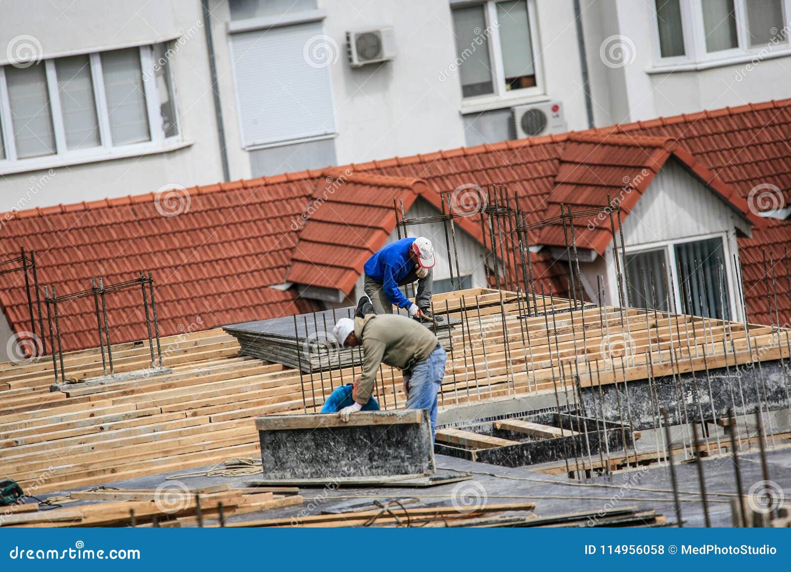 Builders that Works on the Construction Site with Hammer Editorial ...
