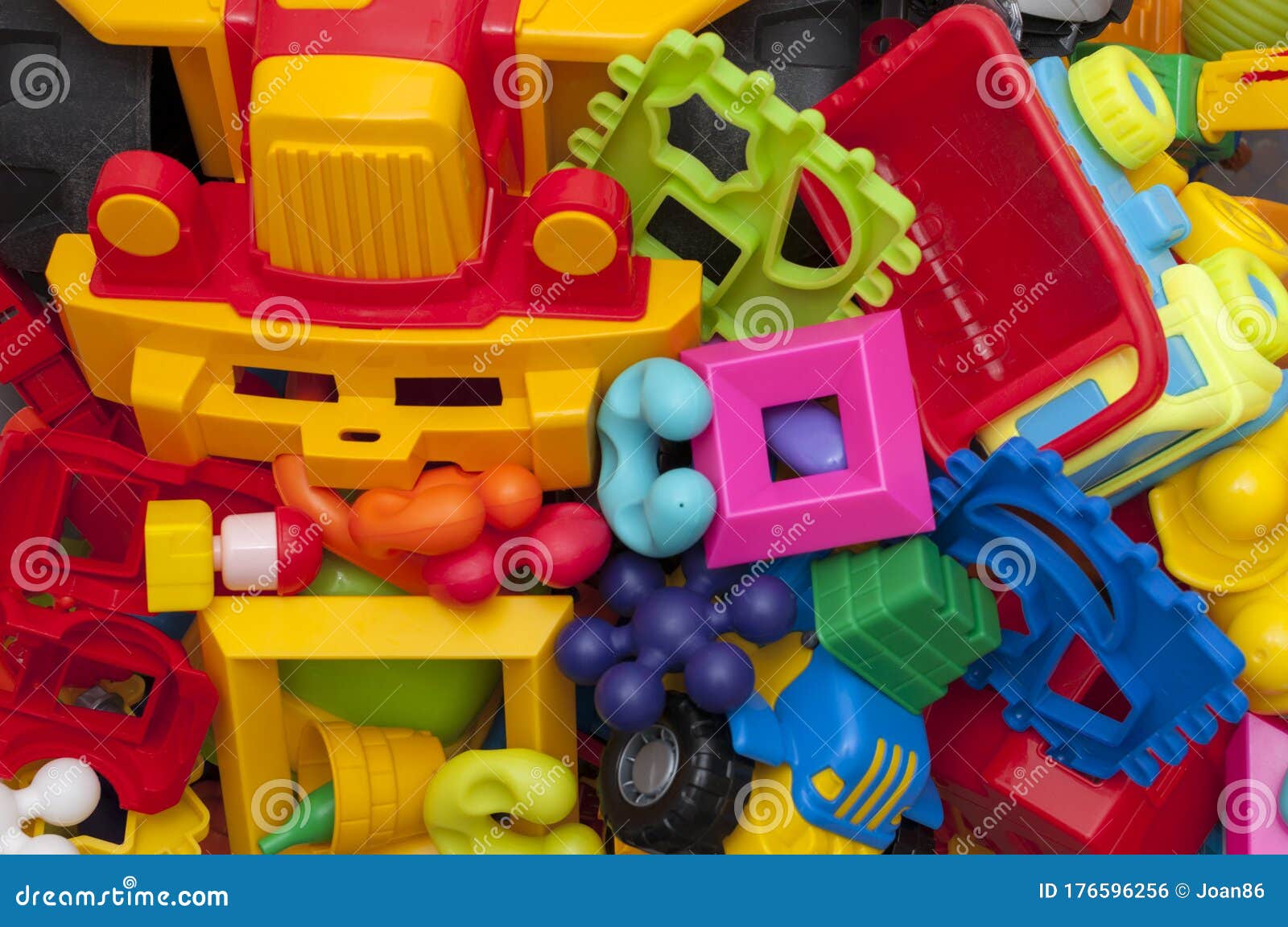 Top View at the Bunch of Multi Colored Plastic Toys of a Little Kid ... Top View at the Bunch of Multi Colored Plastic Toys of a Little Kid ...
