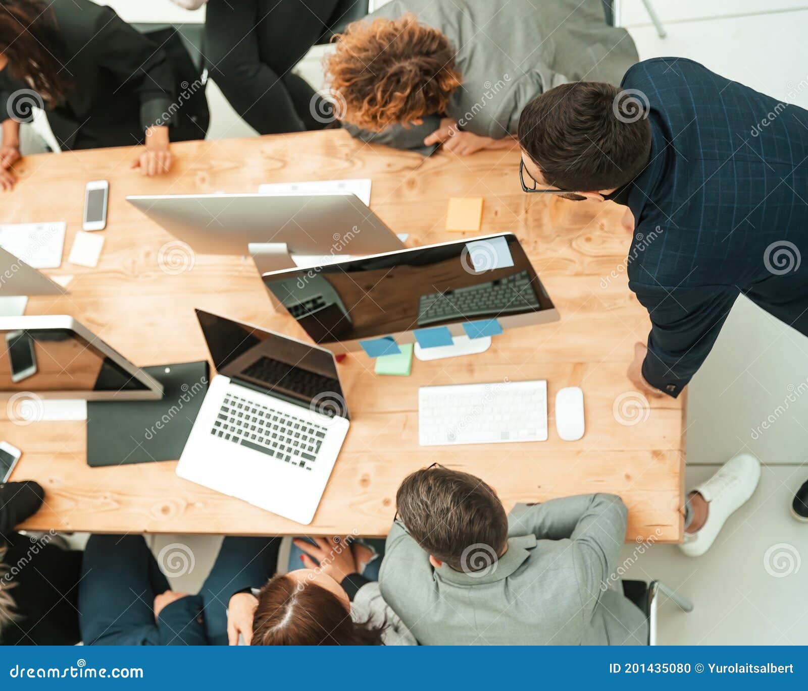 Top View. Business Team Sitting at Desk and Looking at Blank Screen ...